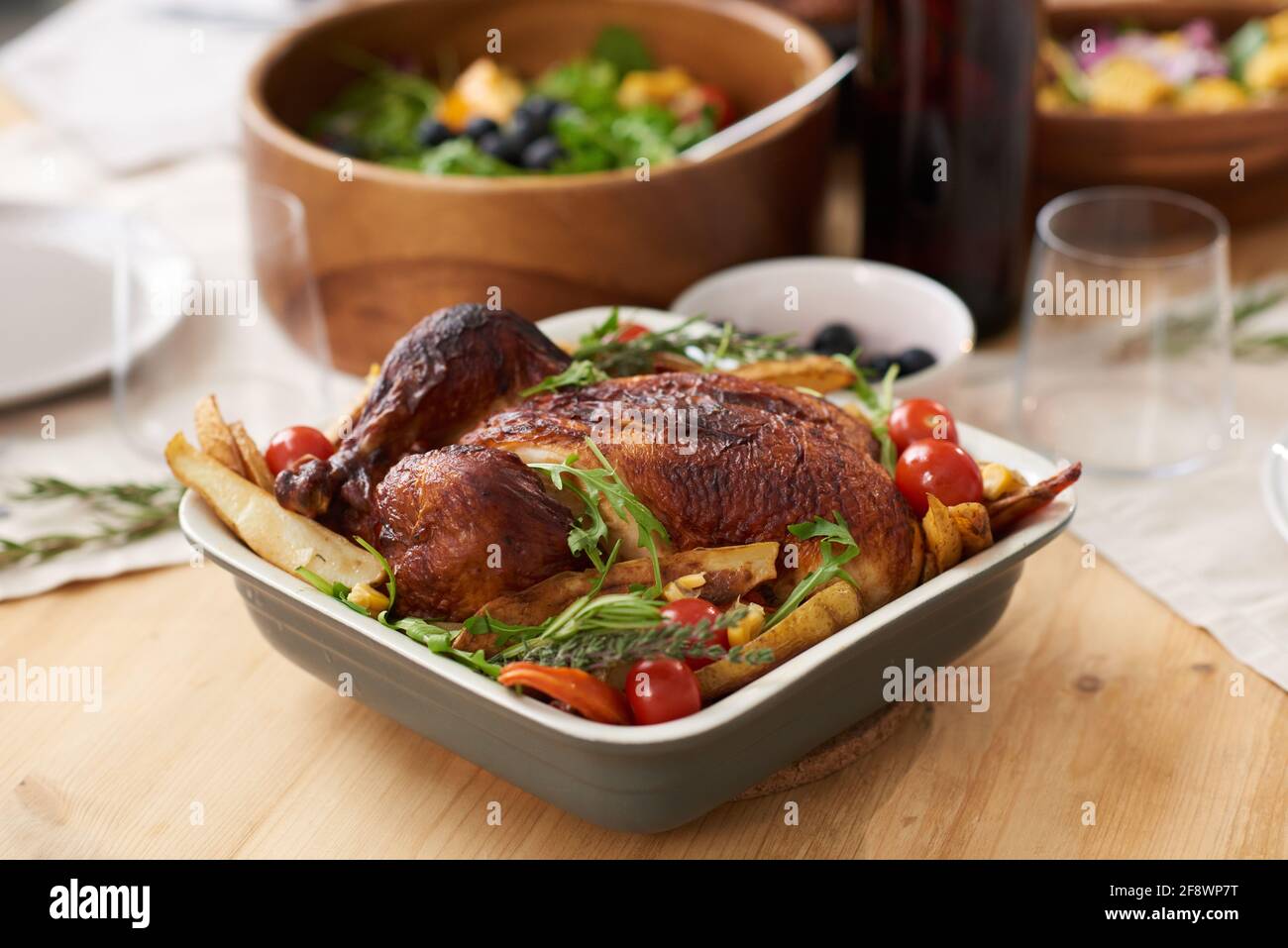 Close-up of dish on dining table roasted chicken with vegetables ...