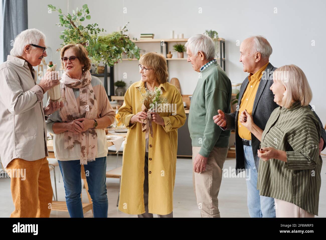 Group of senior people gathering together on social event they standing ...