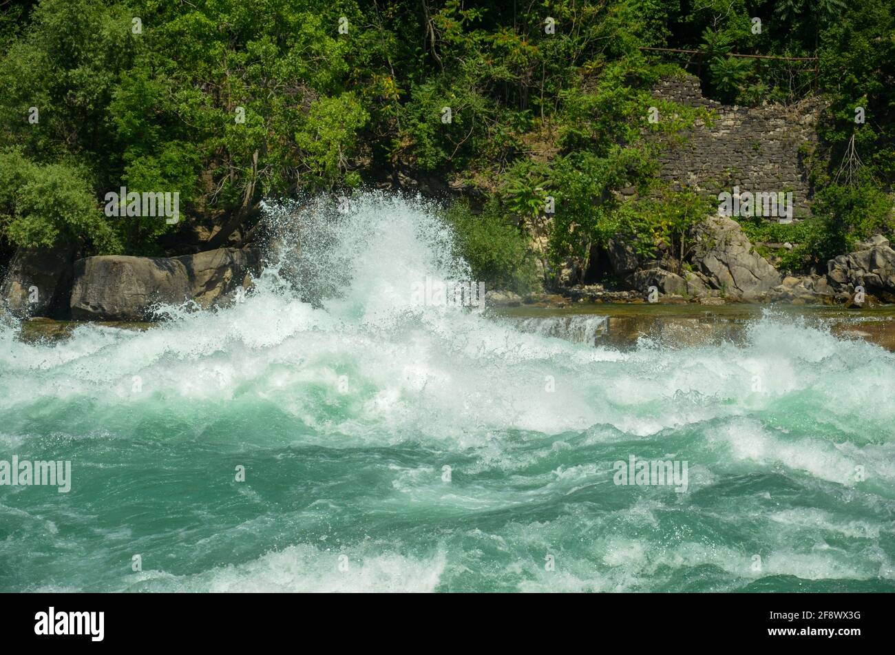 Bubbling rapids of Niagara River flowing over stones and rocks with ...