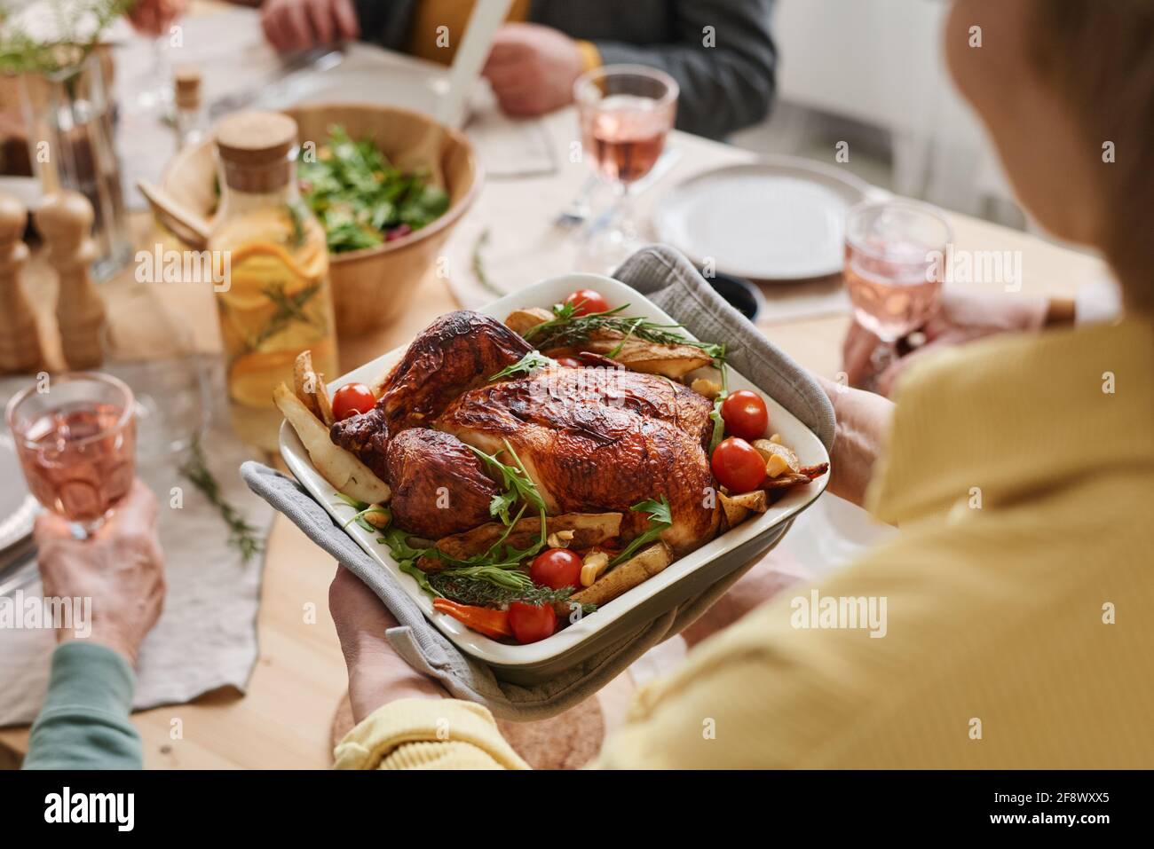 Woman cooking roast chicken in hi-res stock photography and images - Alamy