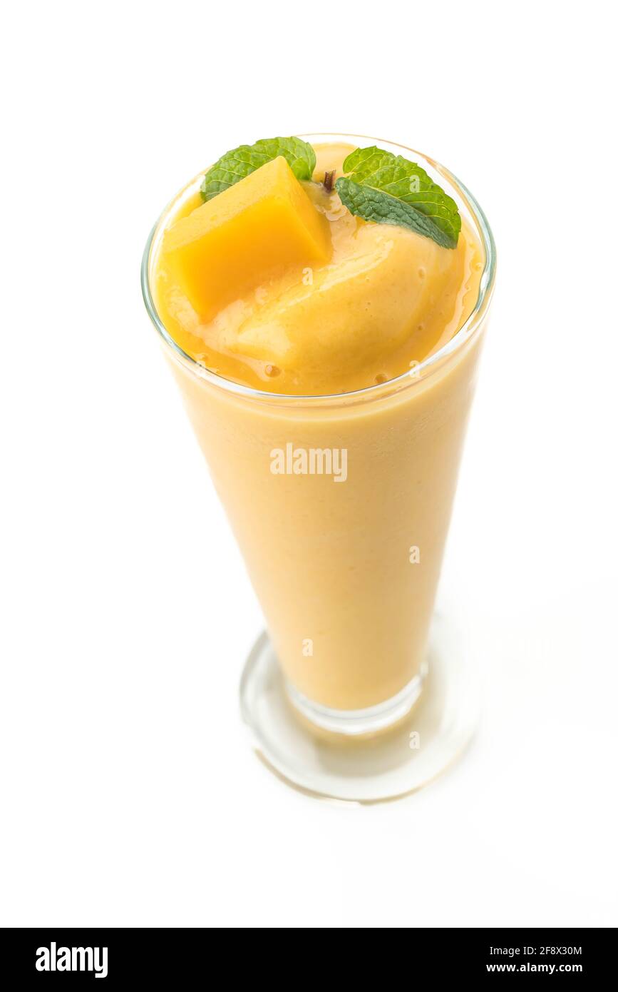 fresh mango smoothie on white background Stock Photo - Alamy