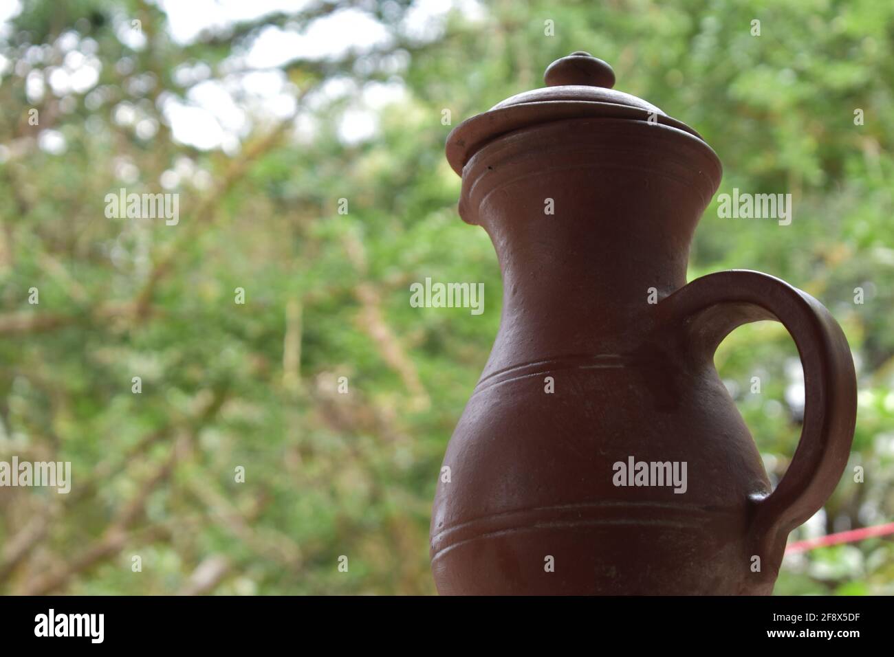 Traditional handmade pot in the natural background Stock Photo - Alamy