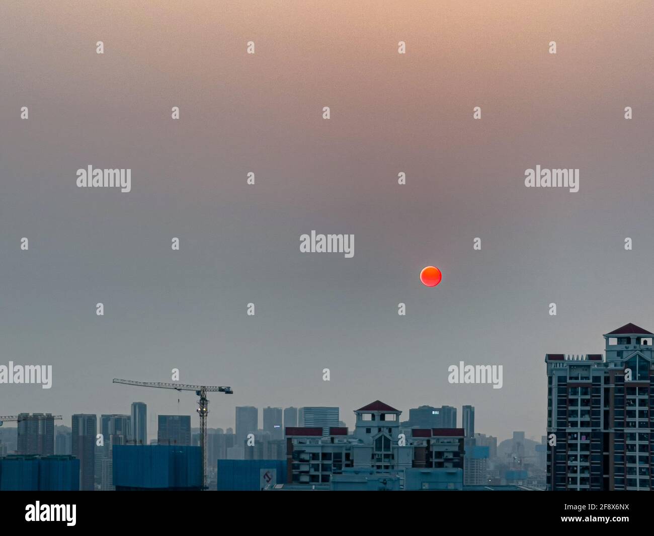 Moonrise over rooftops hi-res stock photography and images - Alamy