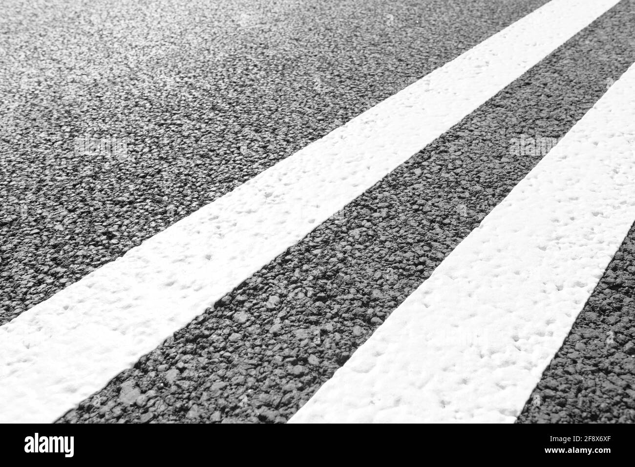 Asphalt road with marking lines white stripes Stock Photo - Alamy