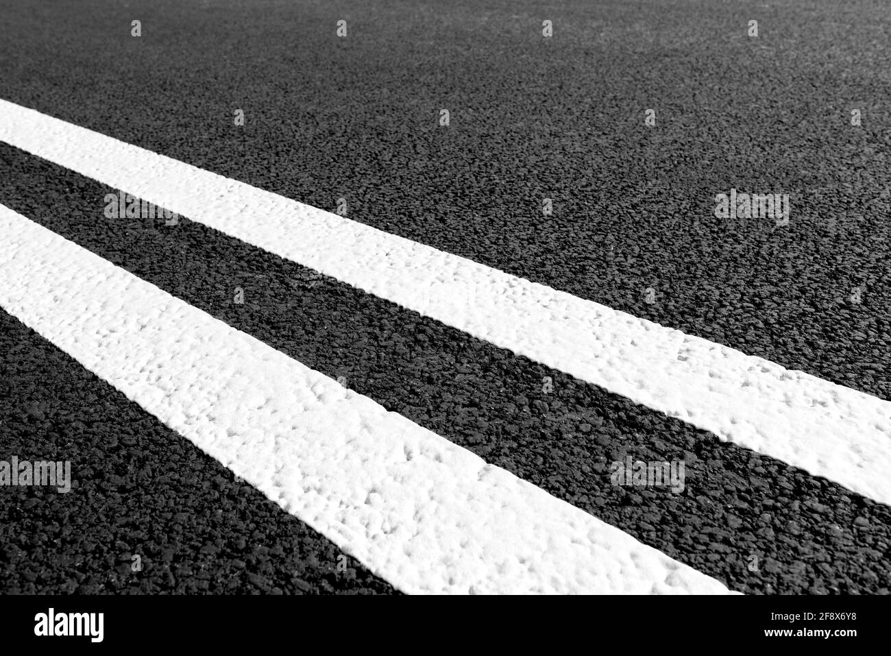 Asphalt road with marking lines white stripes Stock Photo - Alamy