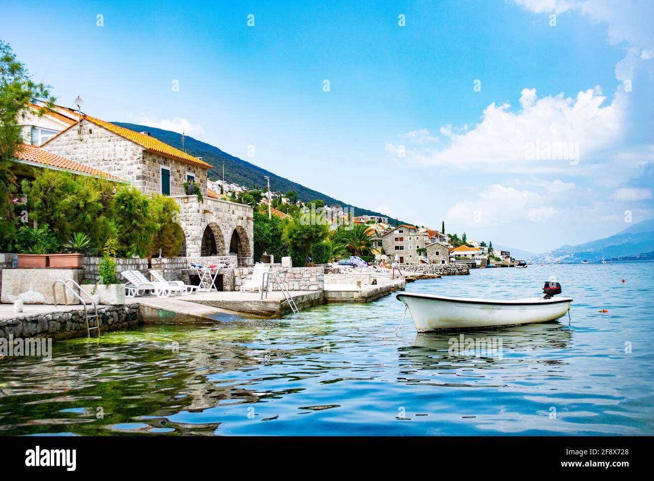 Beautiful photo of a charming village located on the sea shore. Calm ...