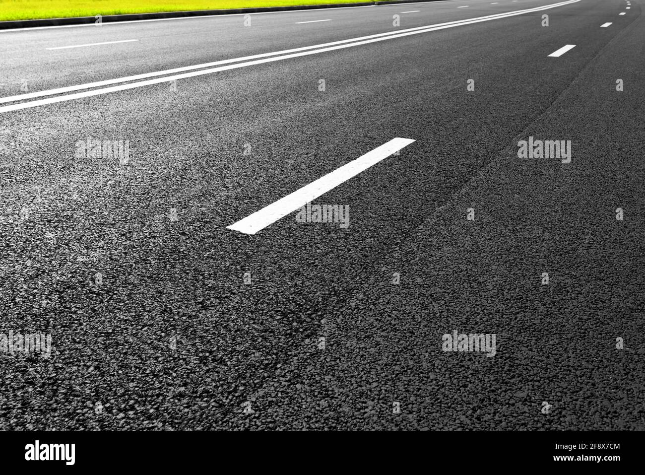 Asphalt road with marking lines white stripes Stock Photo - Alamy
