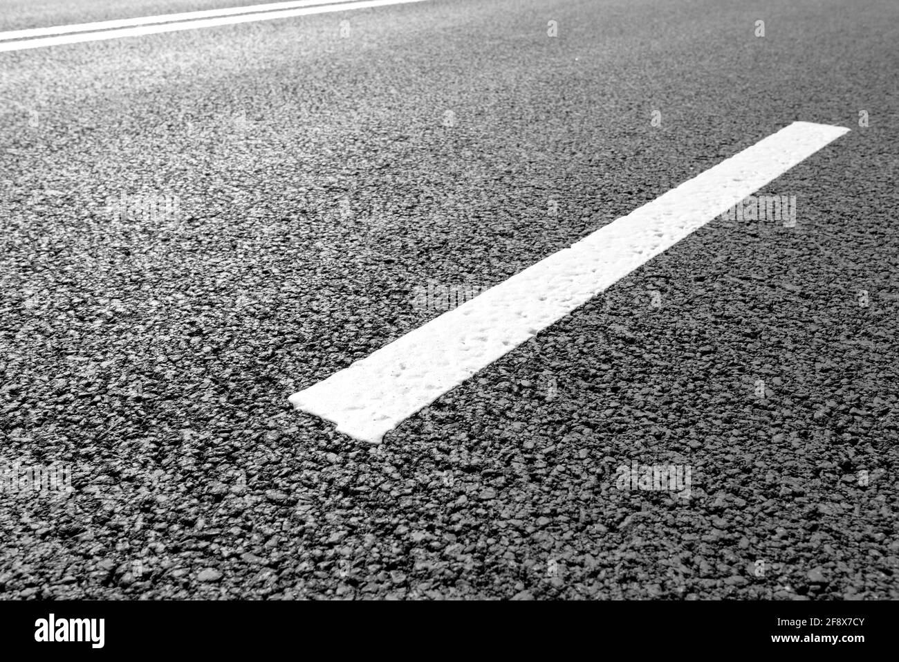 Asphalt road with marking lines white stripes Stock Photo - Alamy