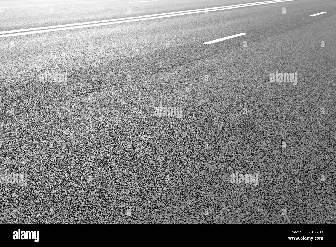 Asphalt road with marking lines white stripes Stock Photo - Alamy