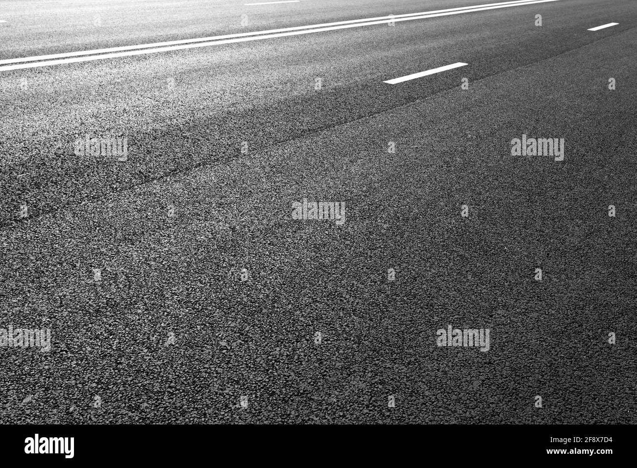 Asphalt road with marking lines white stripes Stock Photo - Alamy