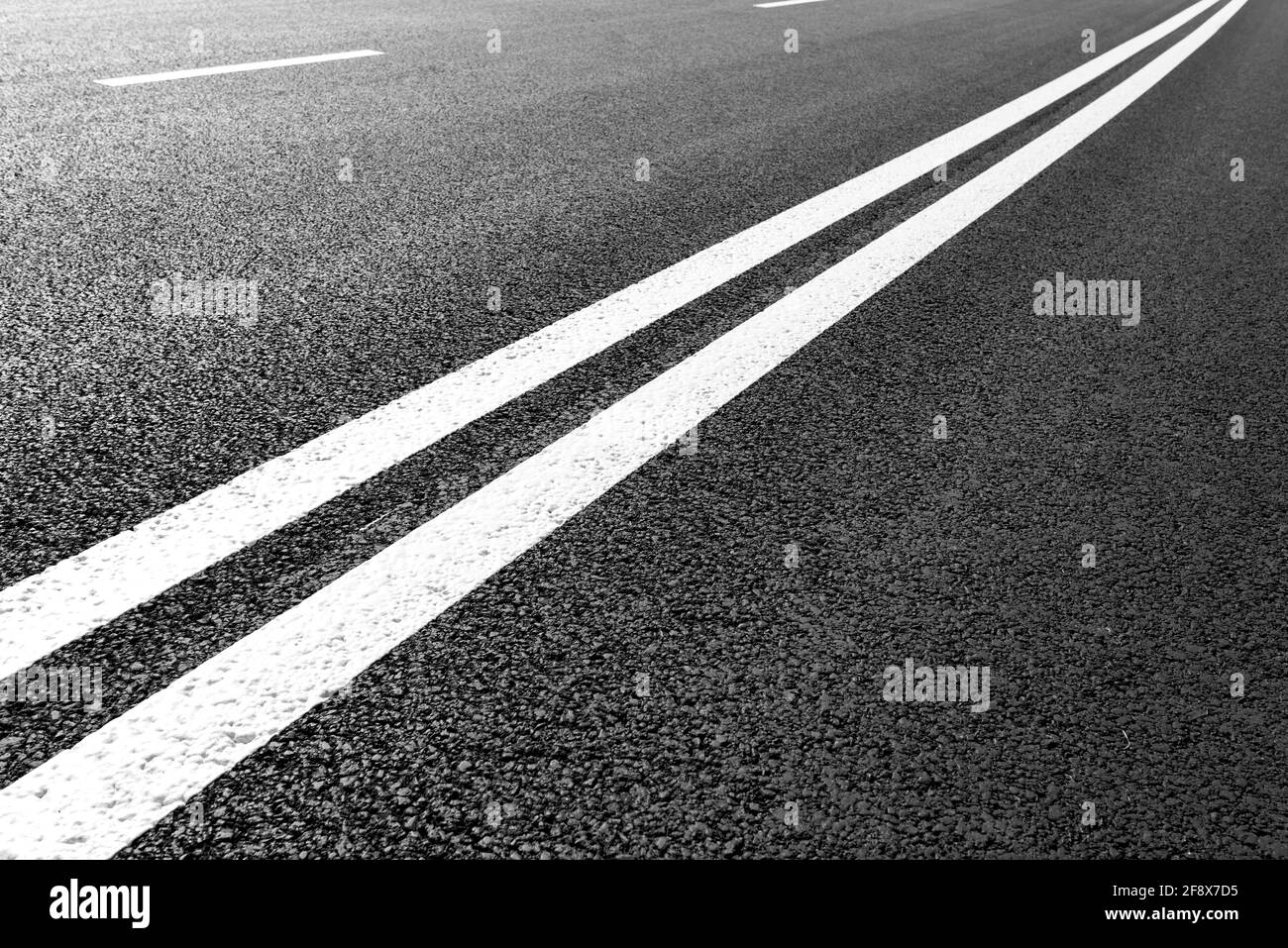 Asphalt road with marking lines white stripes Stock Photo - Alamy