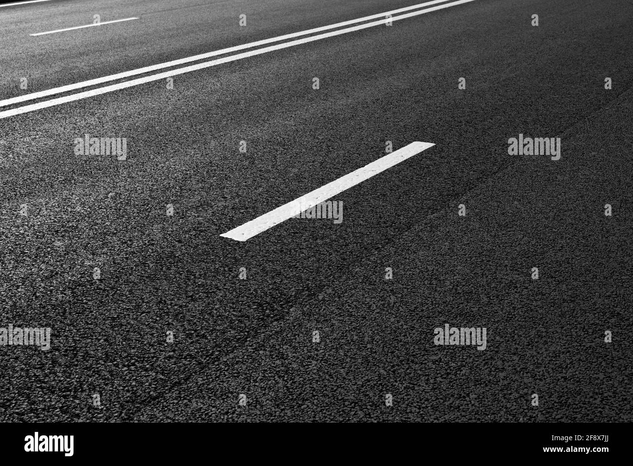 Asphalt road with marking lines white stripes Stock Photo - Alamy