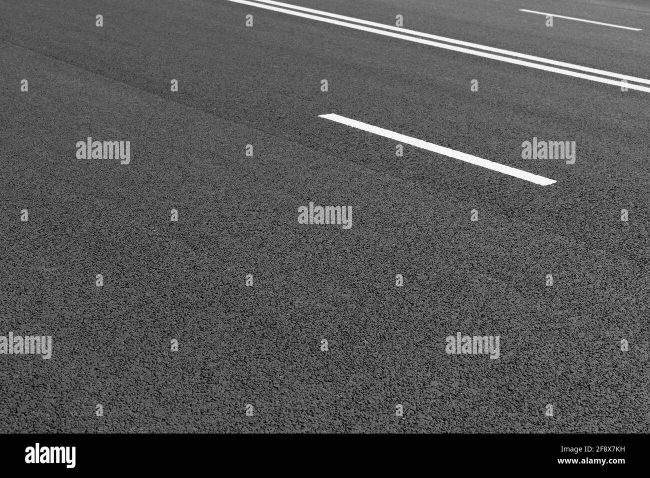 Asphalt road with marking lines white stripes Stock Photo - Alamy