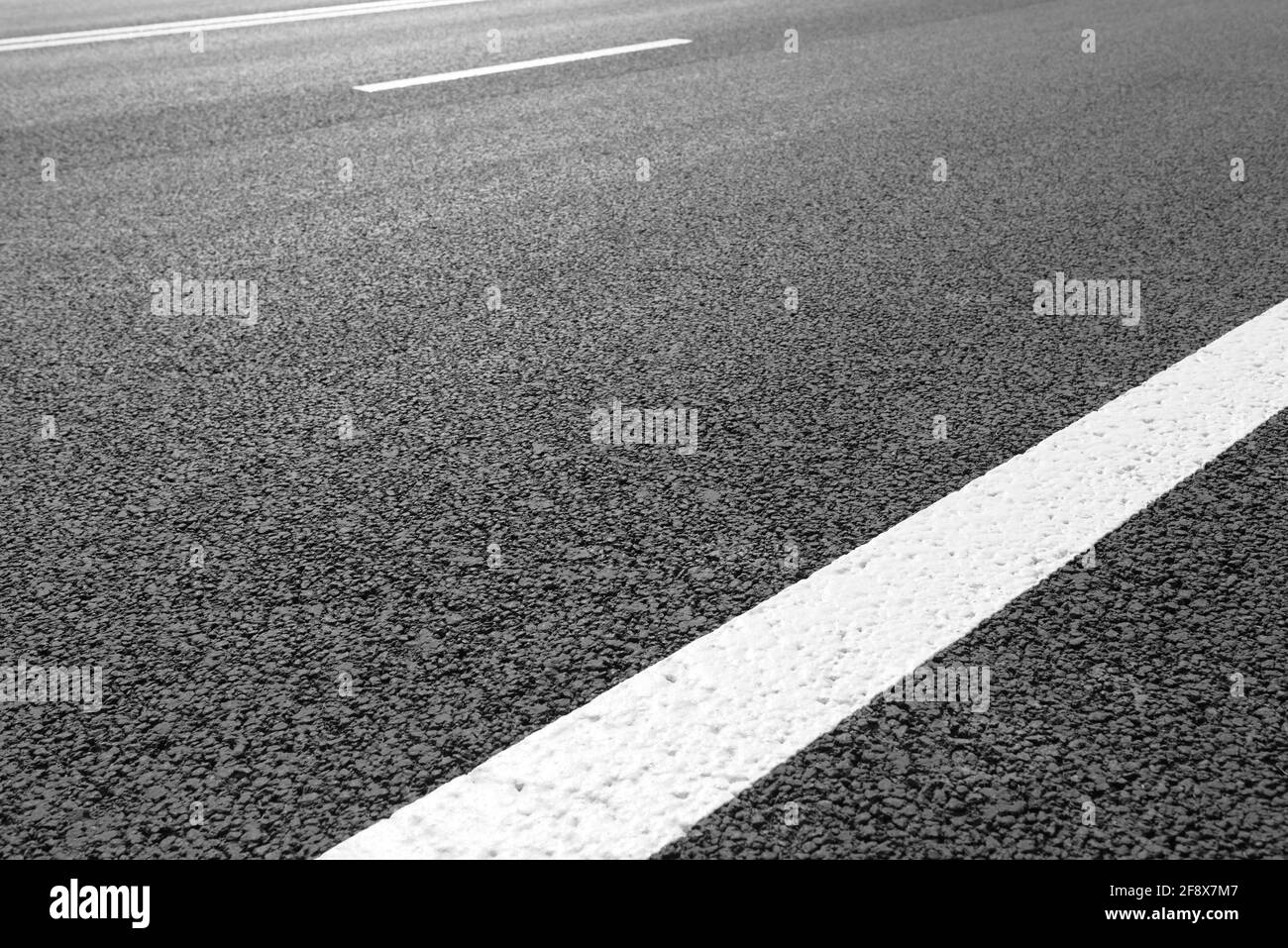 Asphalt road with marking lines white stripes Stock Photo - Alamy