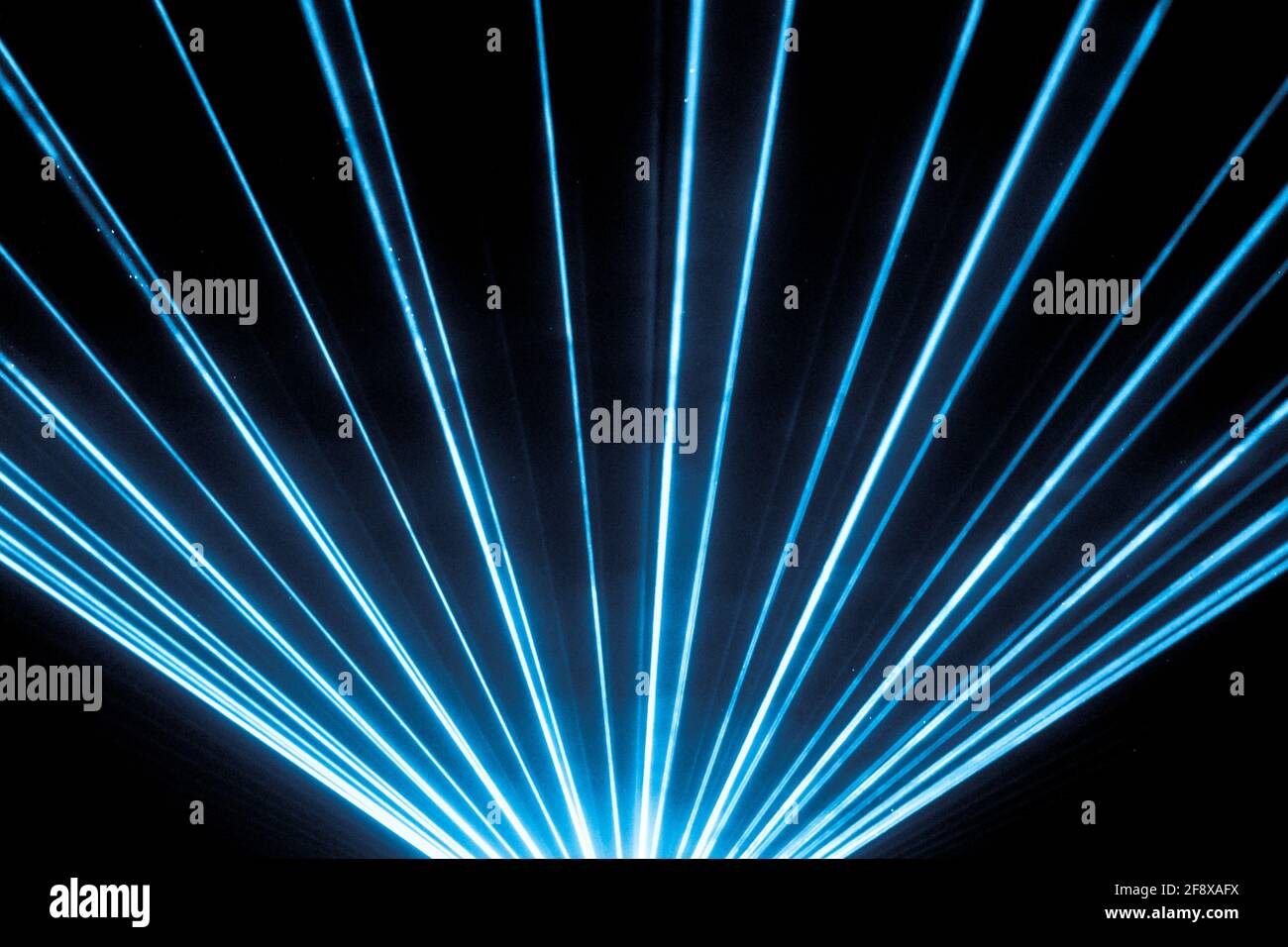 Blue laser show nightlife club stage and shining sparkling rays. Luxury ...