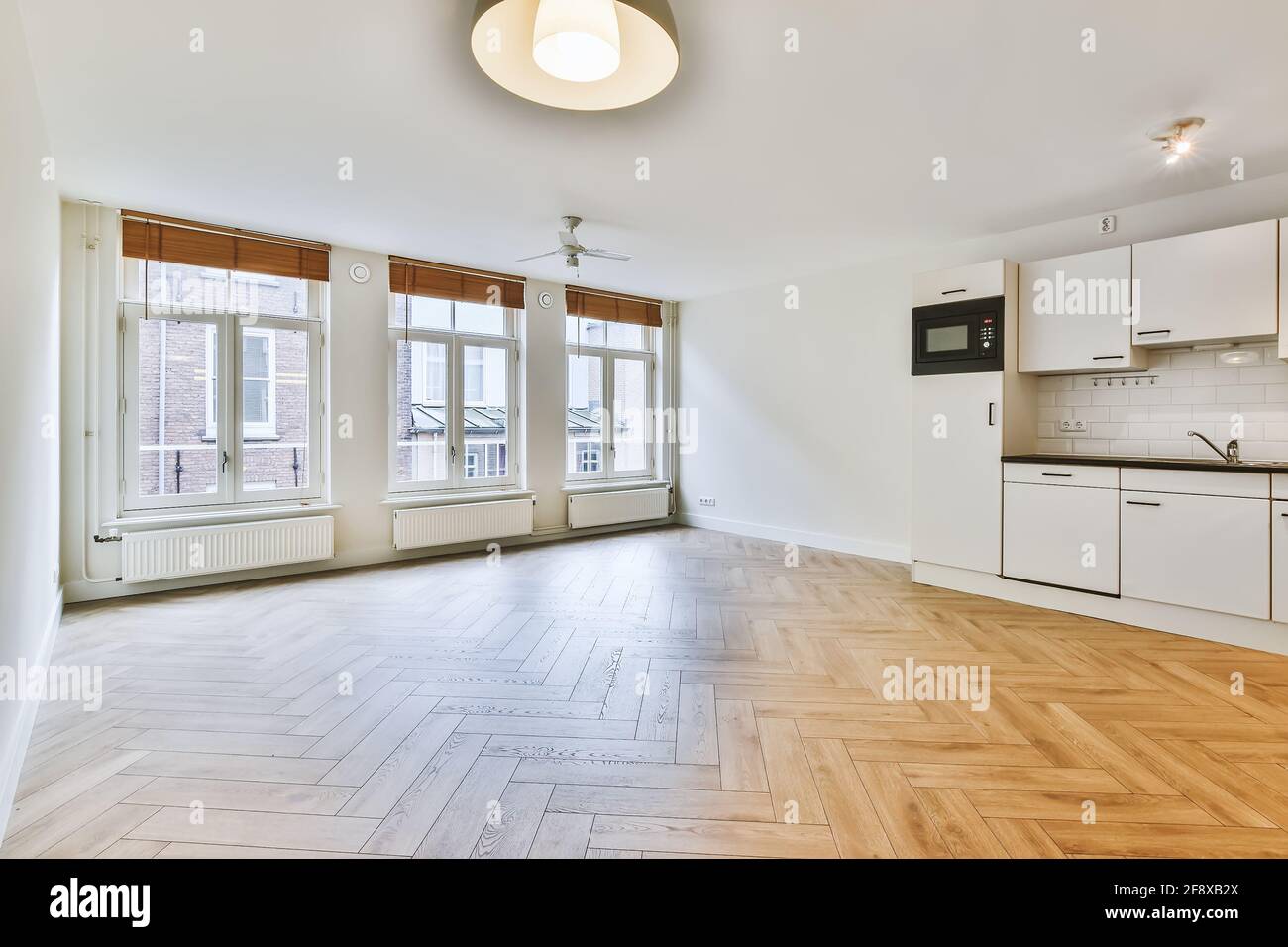 Modern apartment with open kitchen Stock Photo - Alamy