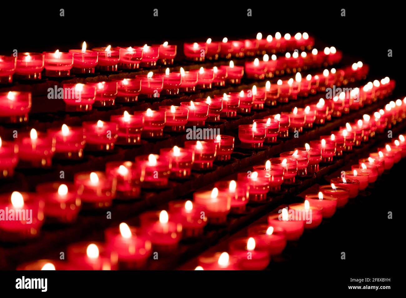 Group of red candles in church for faith resurrection prayer ...