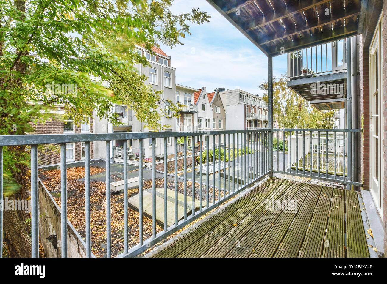 Urban street with residential buildings seen from balcony Stock Photo ...
