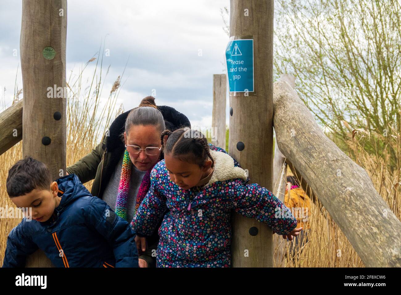 A family visiting WWT London Wetland Centre and enjoying the wildfowl ...