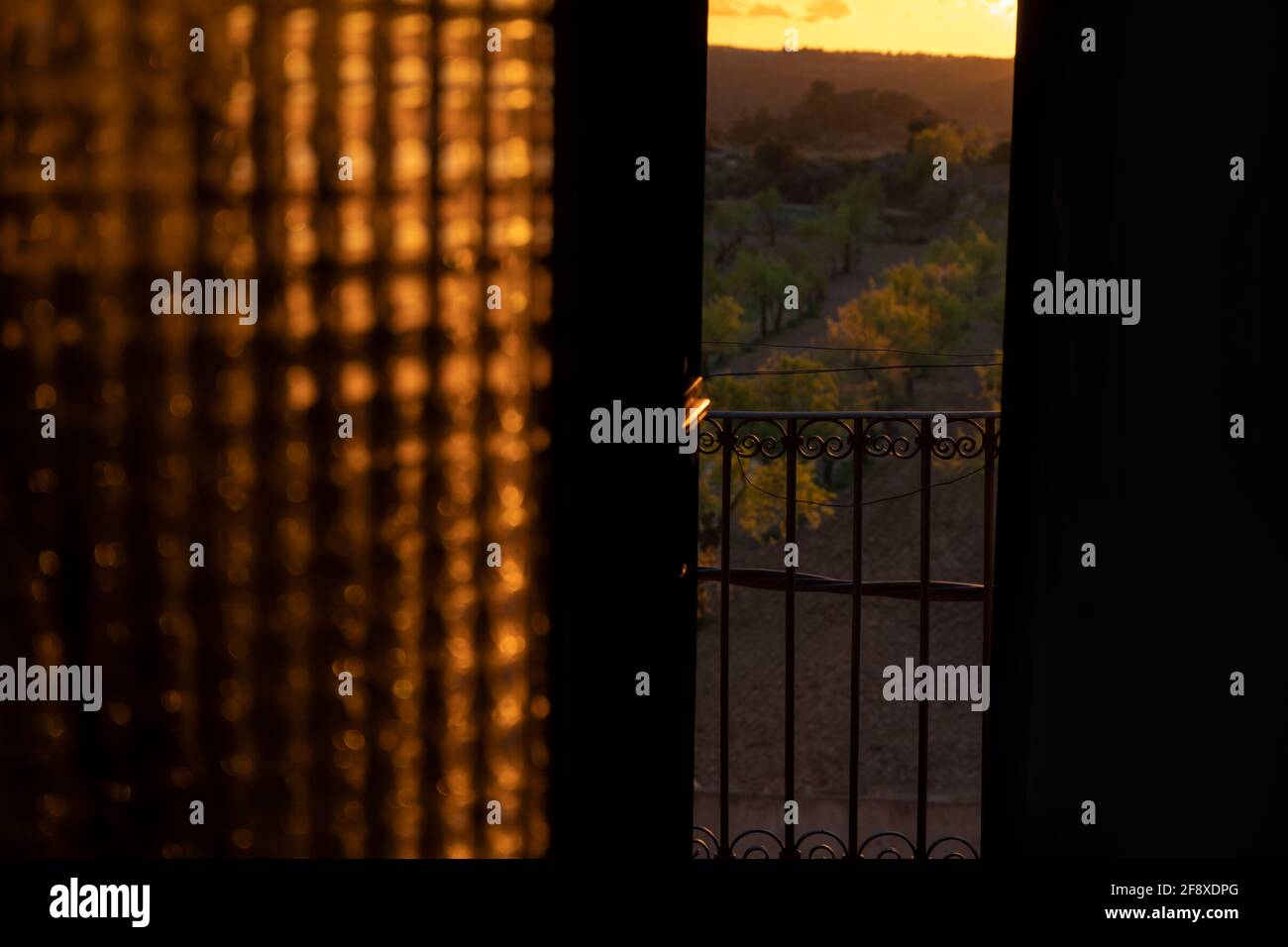 Creative concept of a vintage door with sunset sunlight in glass ...