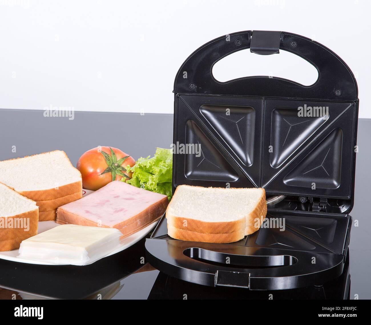 Open Sandwich Toaster with ingredients in a kitchen setting - White ...