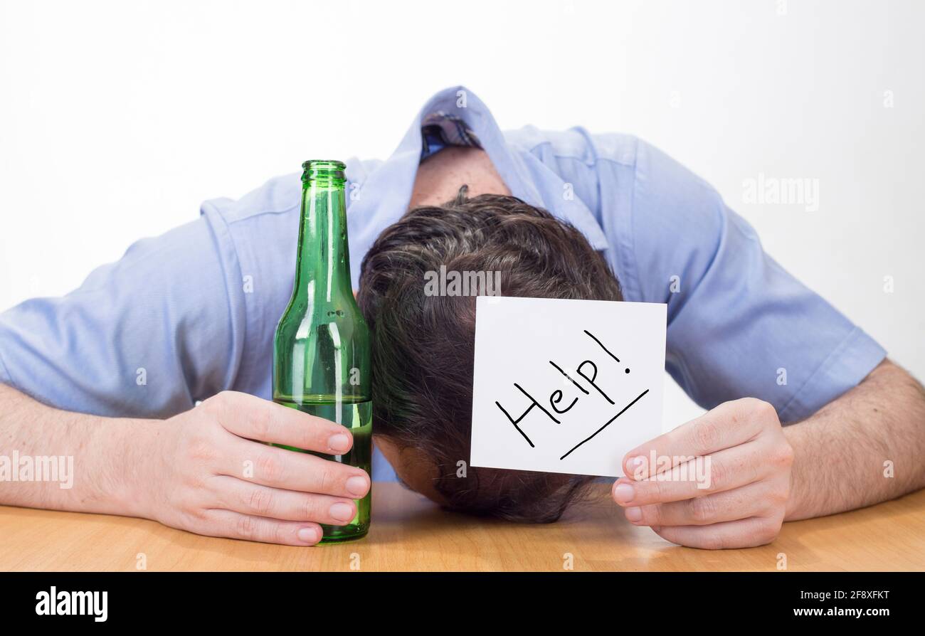 Alcohol addicted man table hi-res stock photography and images - Alamy