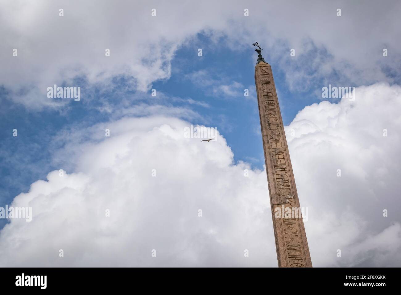 Low-angle shot of the high tower of Obelisk in Navona square in Rome ...
