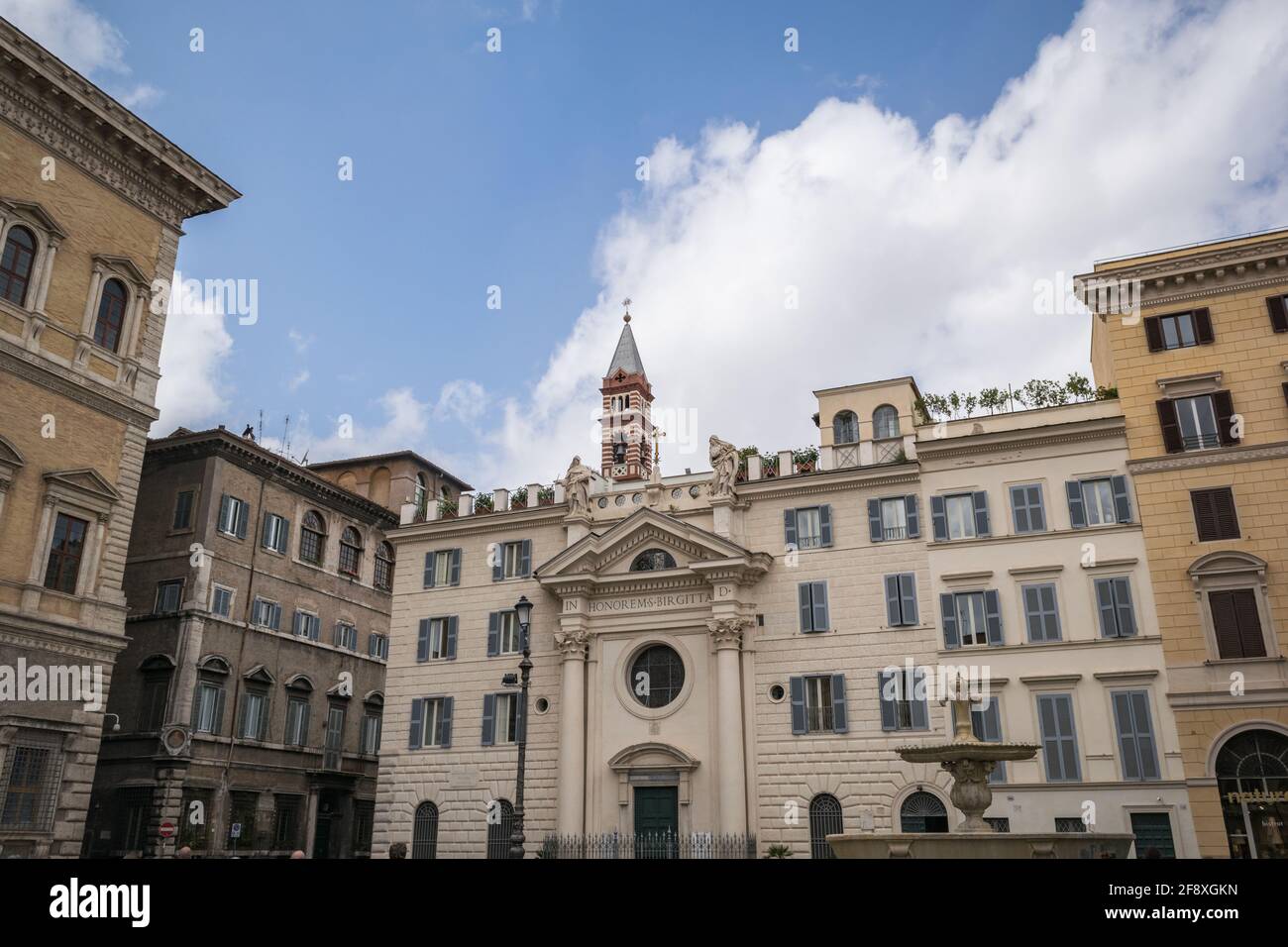 Santa Brigida under a blue cloudy sky and sunlight in Rome, Italy Stock ...
