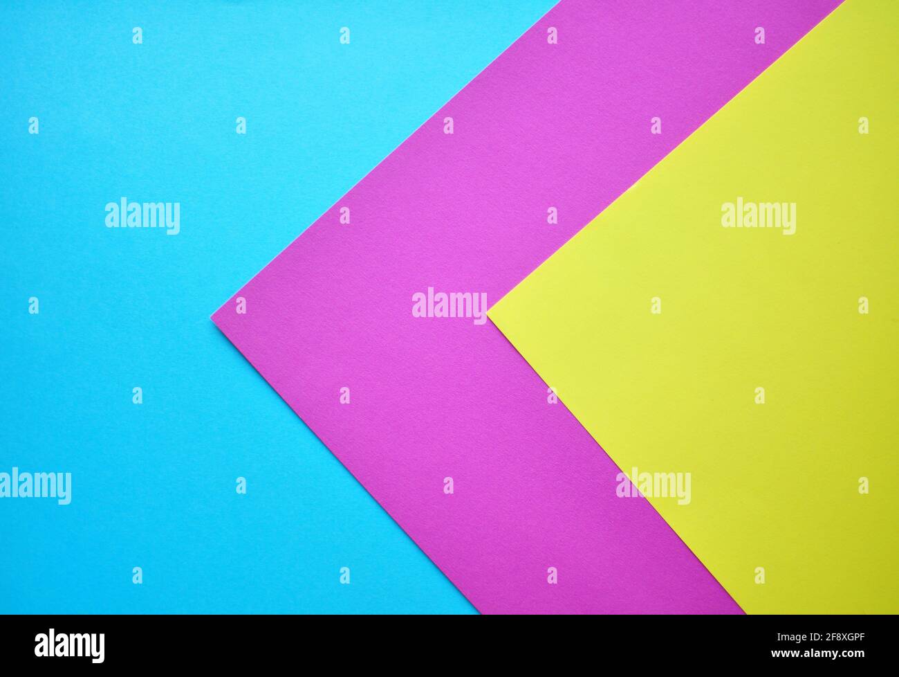 Multicolored paper, paper background. Colored paper in blue, pink and ...