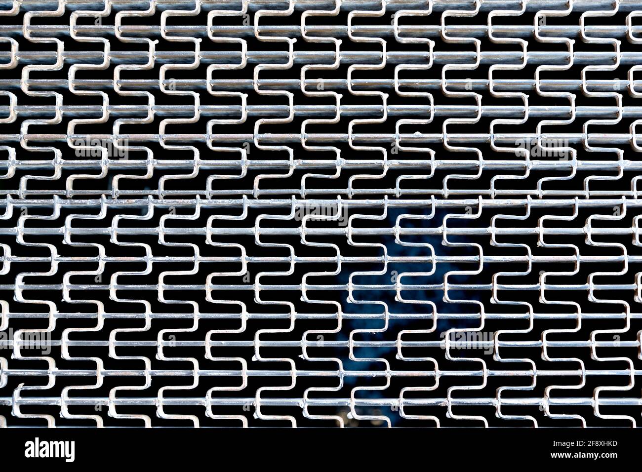 Close up of iron grid texture background silver metal pattern on the ...
