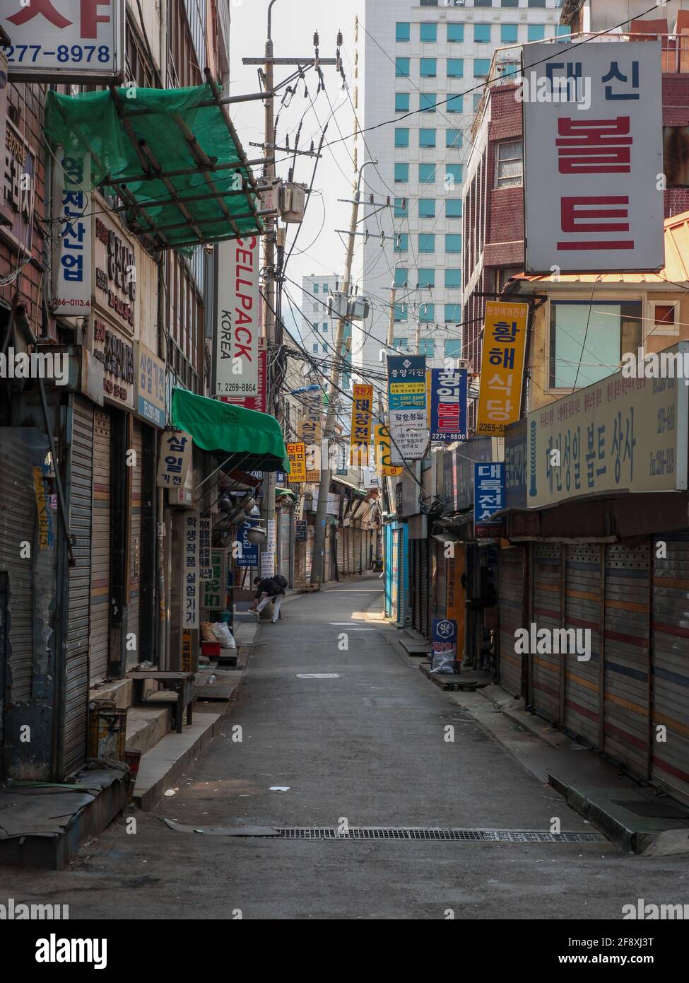 One of the many old, traditional alleys with local shops and ...