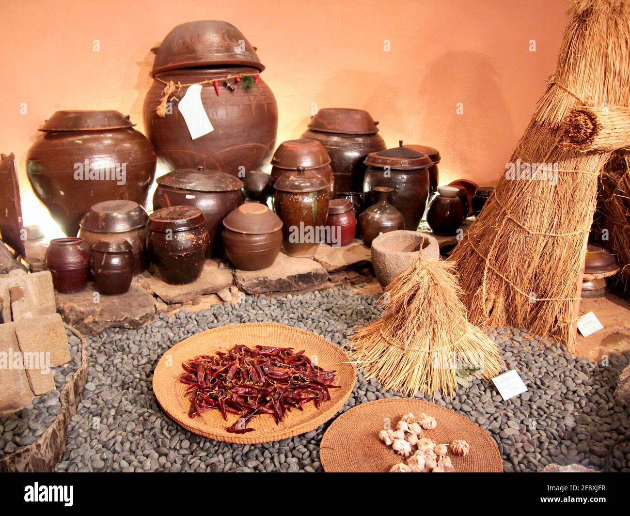 Display of typical big, clay mason vases used for fermentation. At the ...