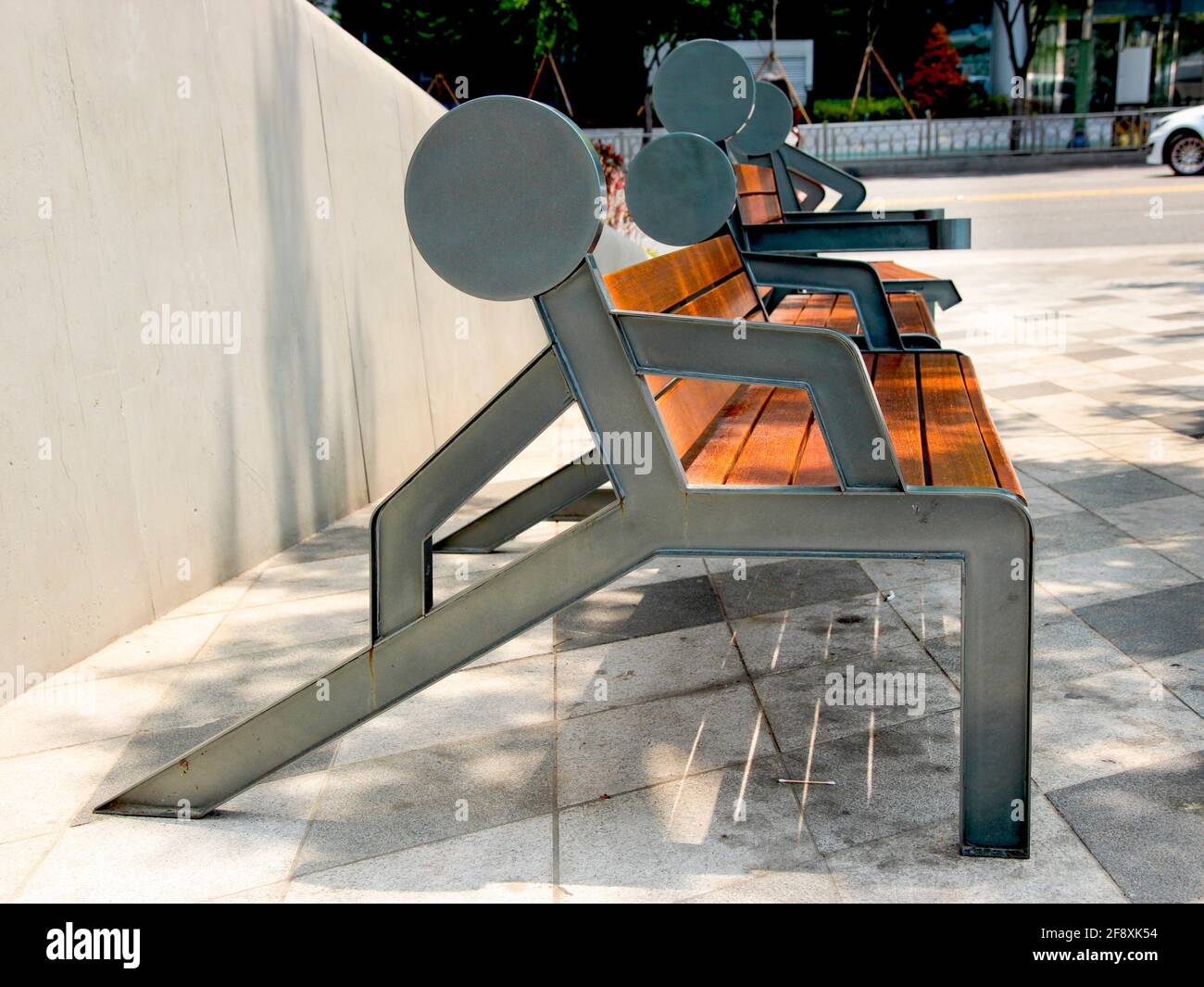 A fun, cute, adorable wood and metal public bench in a park, designed ...