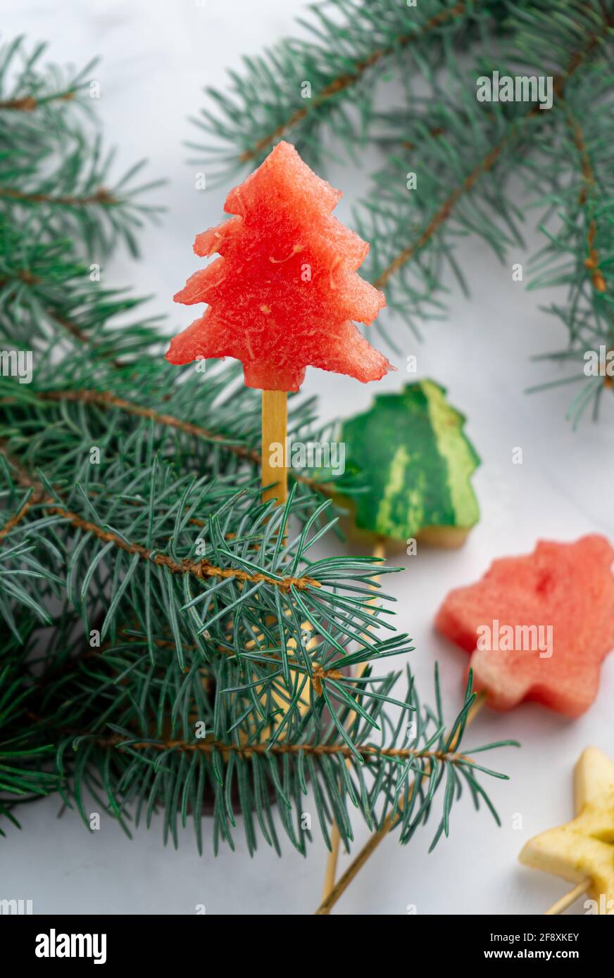 Watermelon ice cream in the shape of a Christmas tree. Summer fruit ...