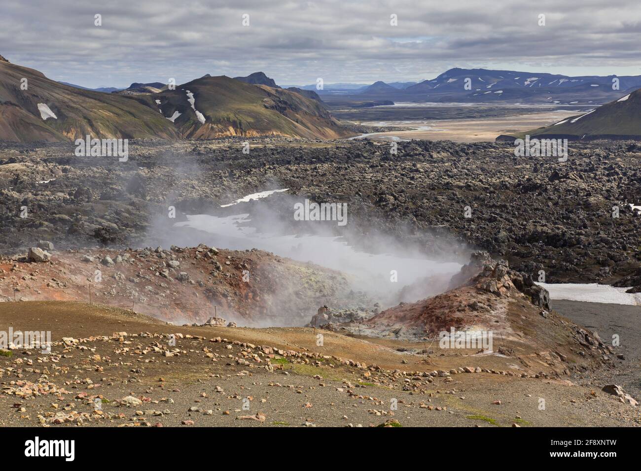 Steam from fumaroles / solfataras at rhyolite mountains at ...