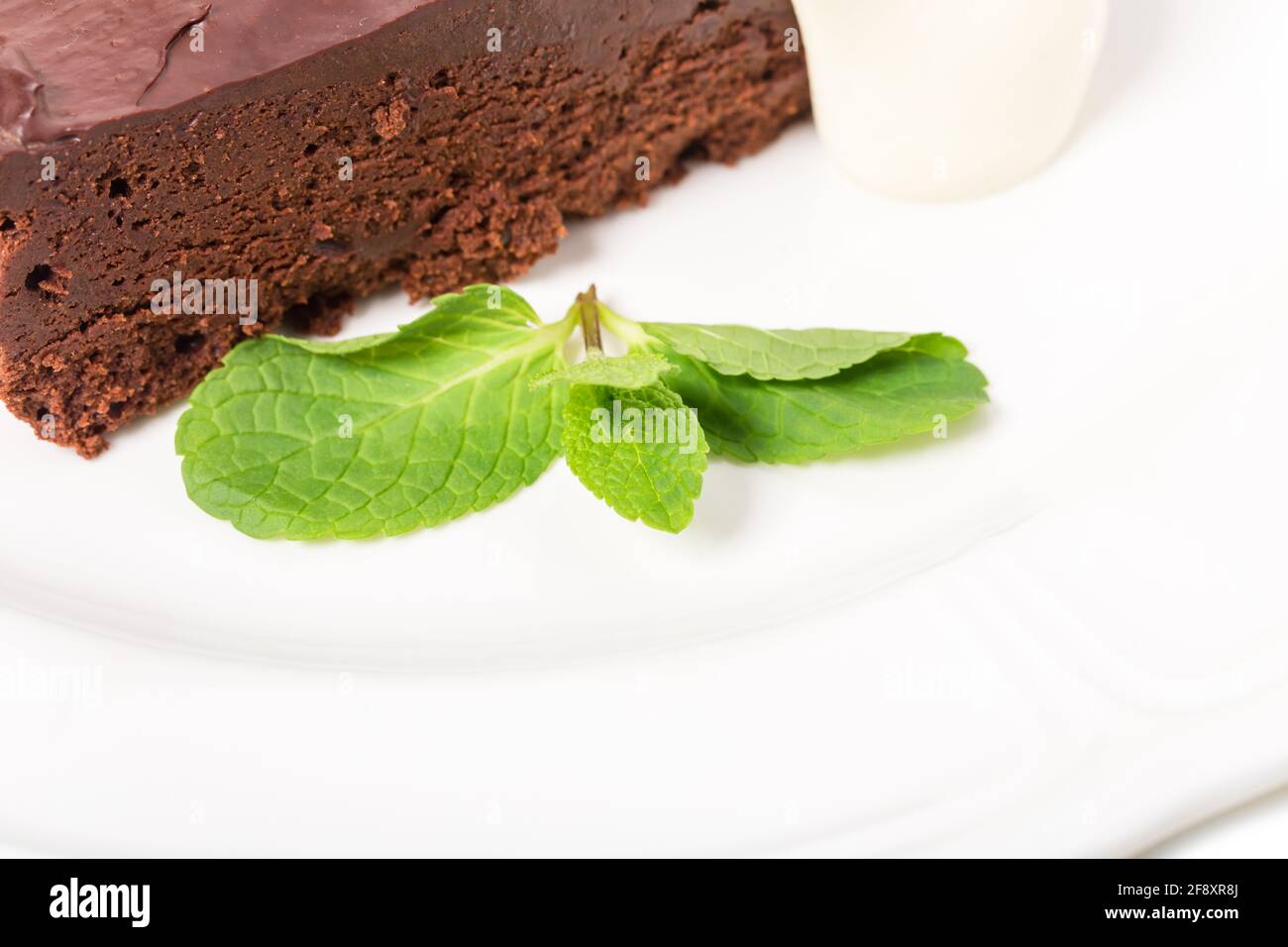 Chocolate cake with ice cream scoop on a sliced orange and mascarpone ...