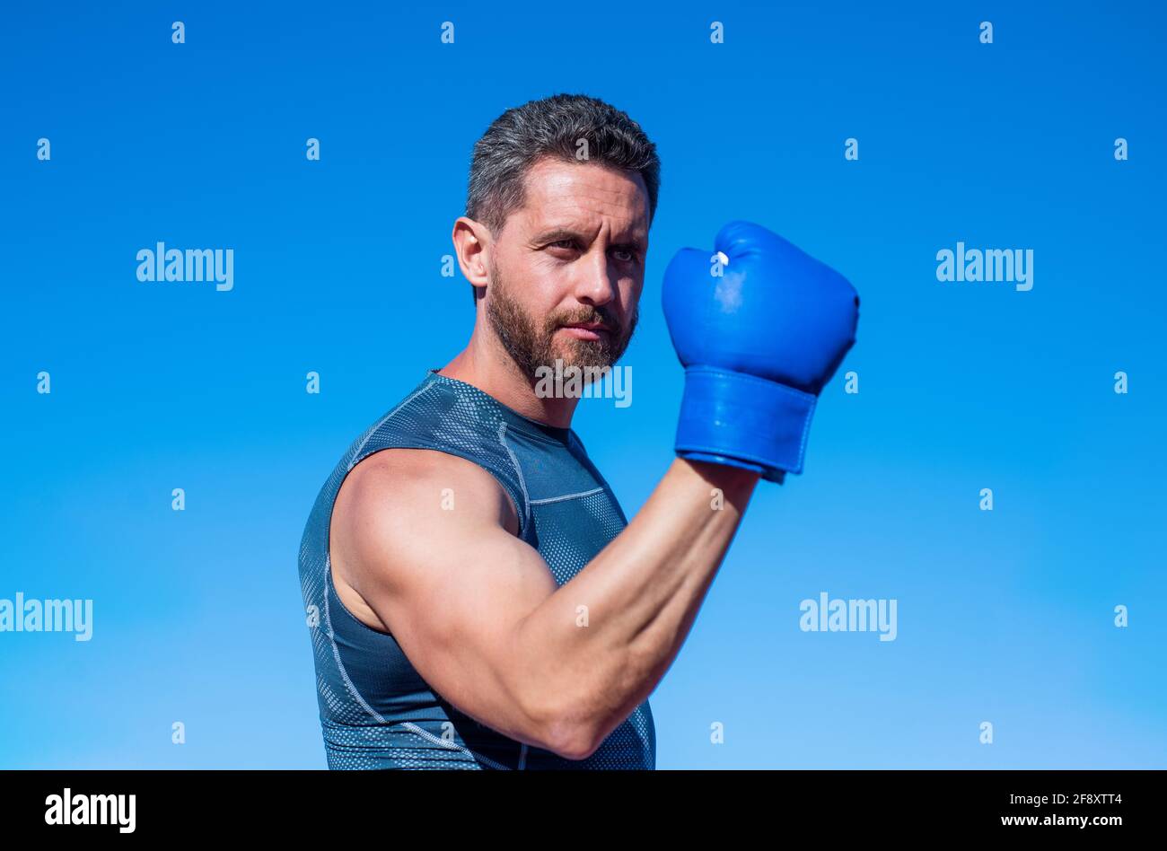 knockout. man boxer punching. fitness gym outdoor. muscular athletic ...