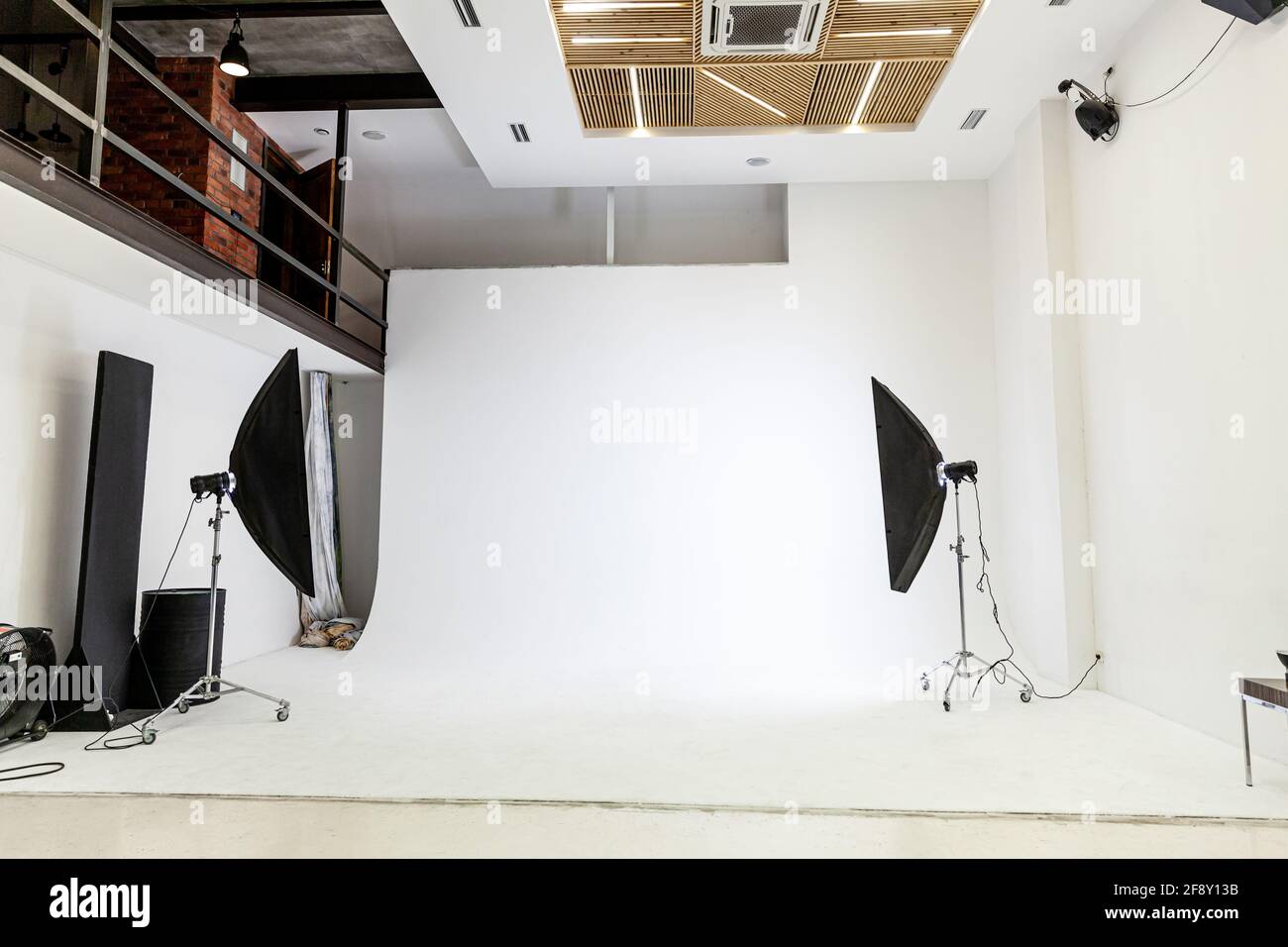 Empty photo studio with lighting equipment. Photographer workplace ...