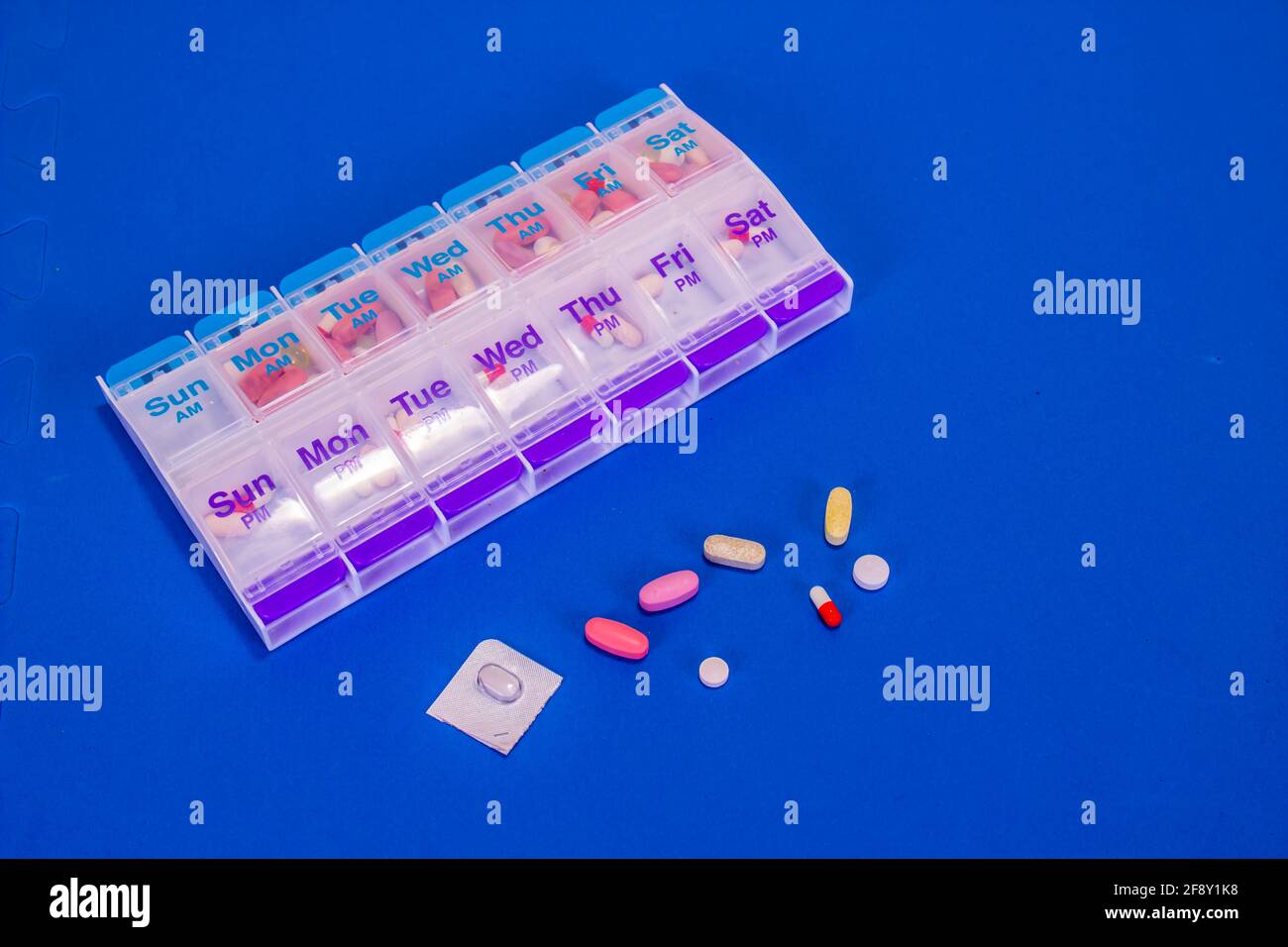 Weekly Morning & Evening Pill Box Container Stock Photo - Alamy