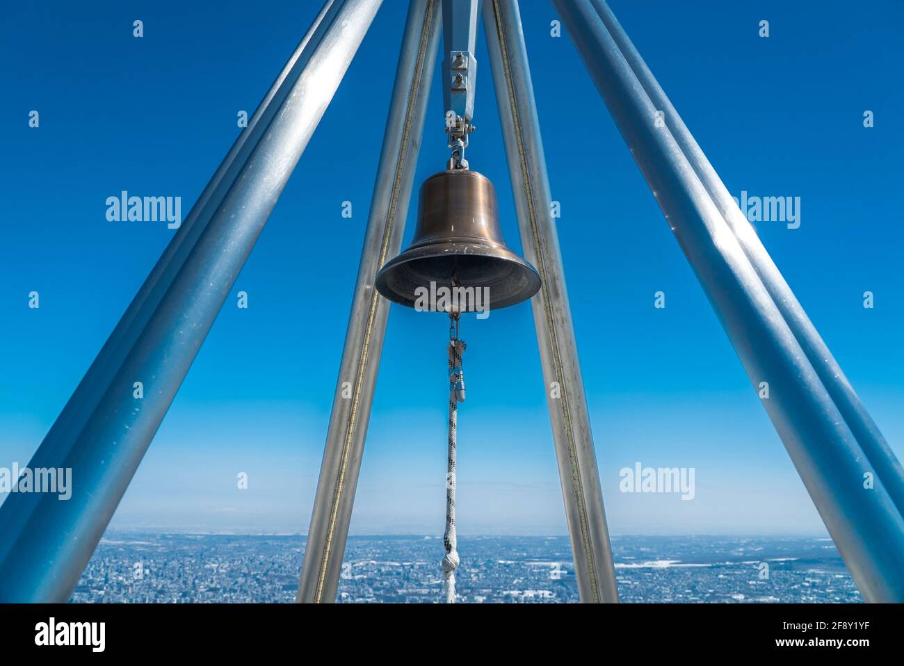 Mount Moiwa ringing bell. Mountain peak with blue sky. Winter views of ...