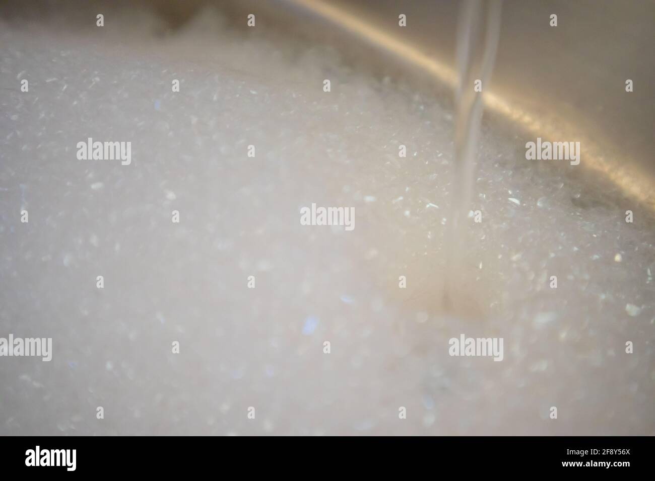 Cape Town, South Africa - 06-04-2021 Kitchen tap filling sink with ...