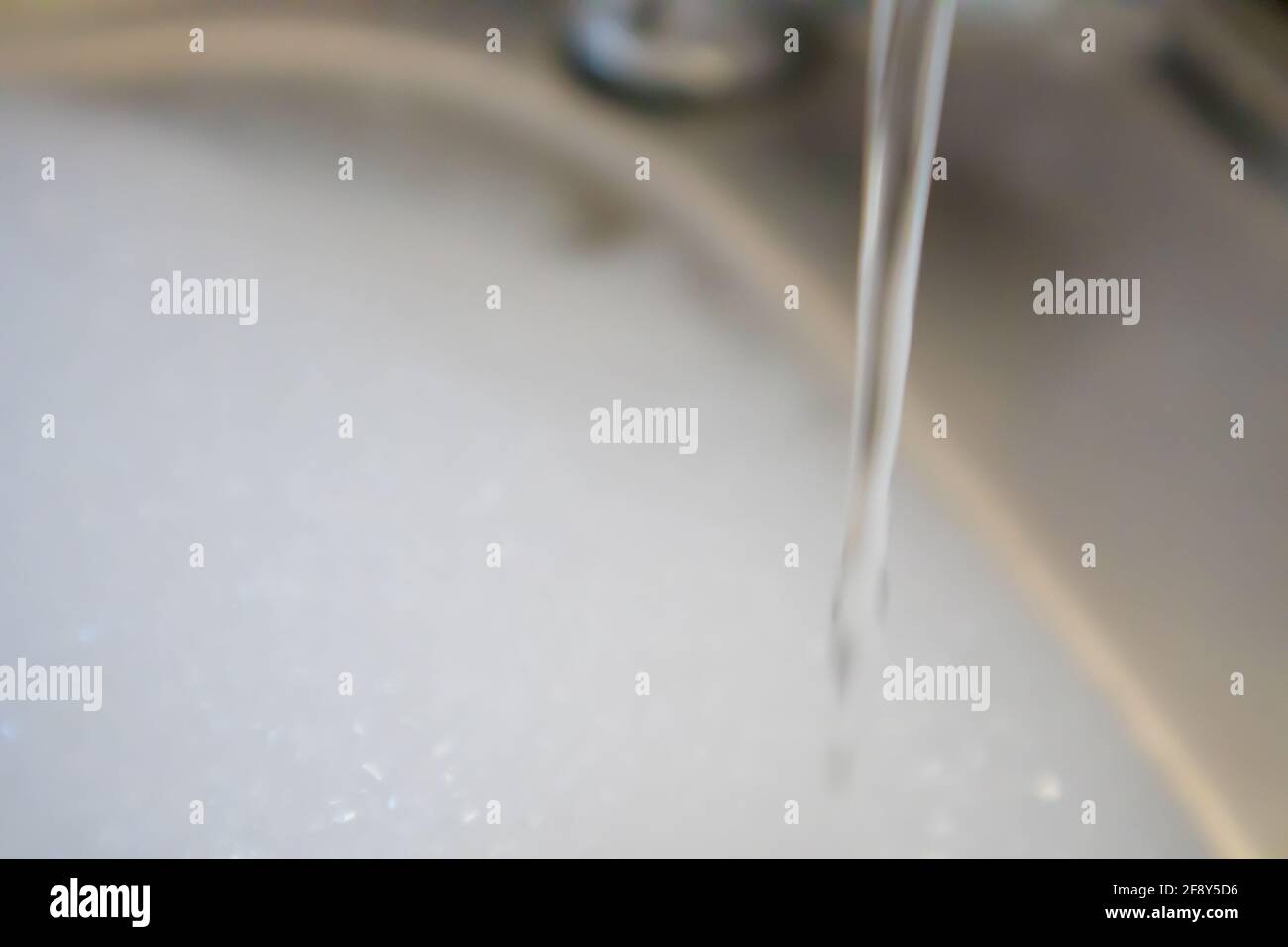 Cape Town, South Africa - 06-04-2021 Kitchen tap filling sink with ...