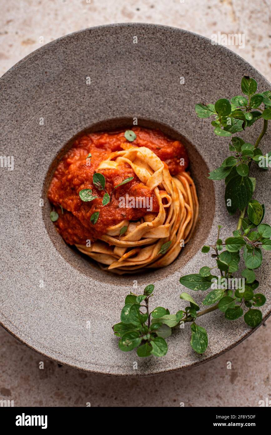 Marinara Pasta in a grey bowl Stock Photo - Alamy