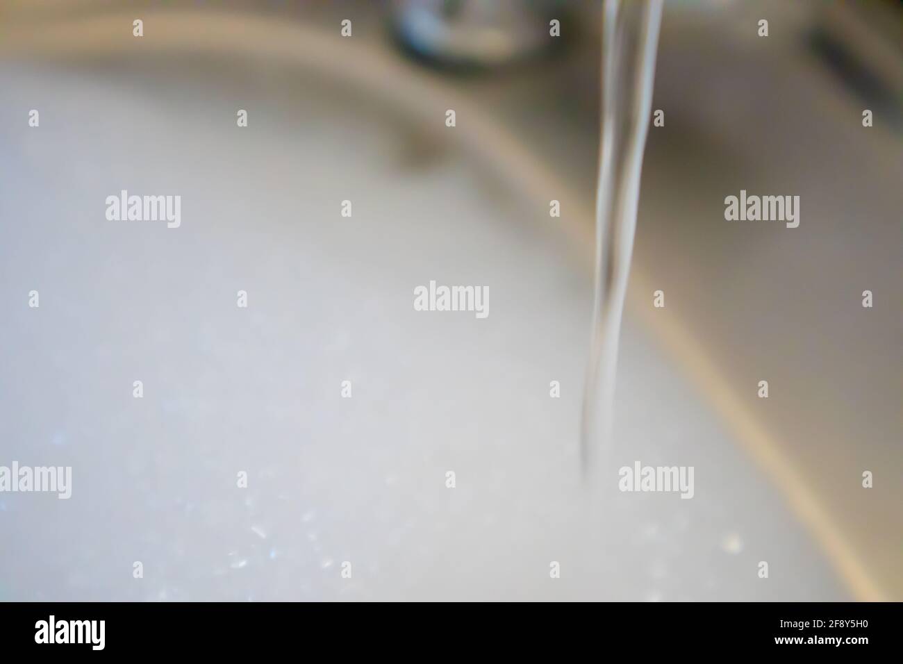 Cape Town, South Africa - 06-04-2021 Kitchen tap filling sink with ...