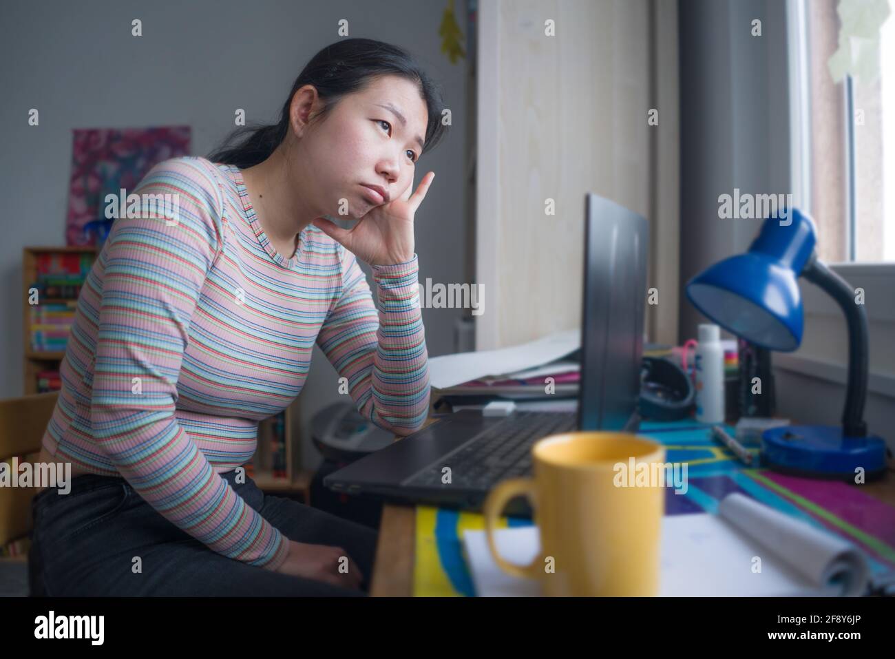 lifestyle portrait of young stressed and worried Asian Chinese woman ...