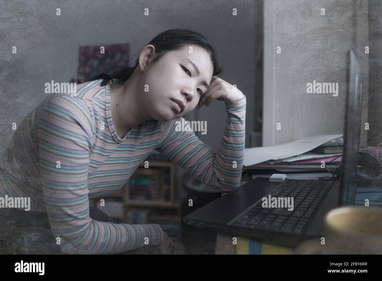lifestyle portrait of young stressed and worried Asian Chinese woman ...
