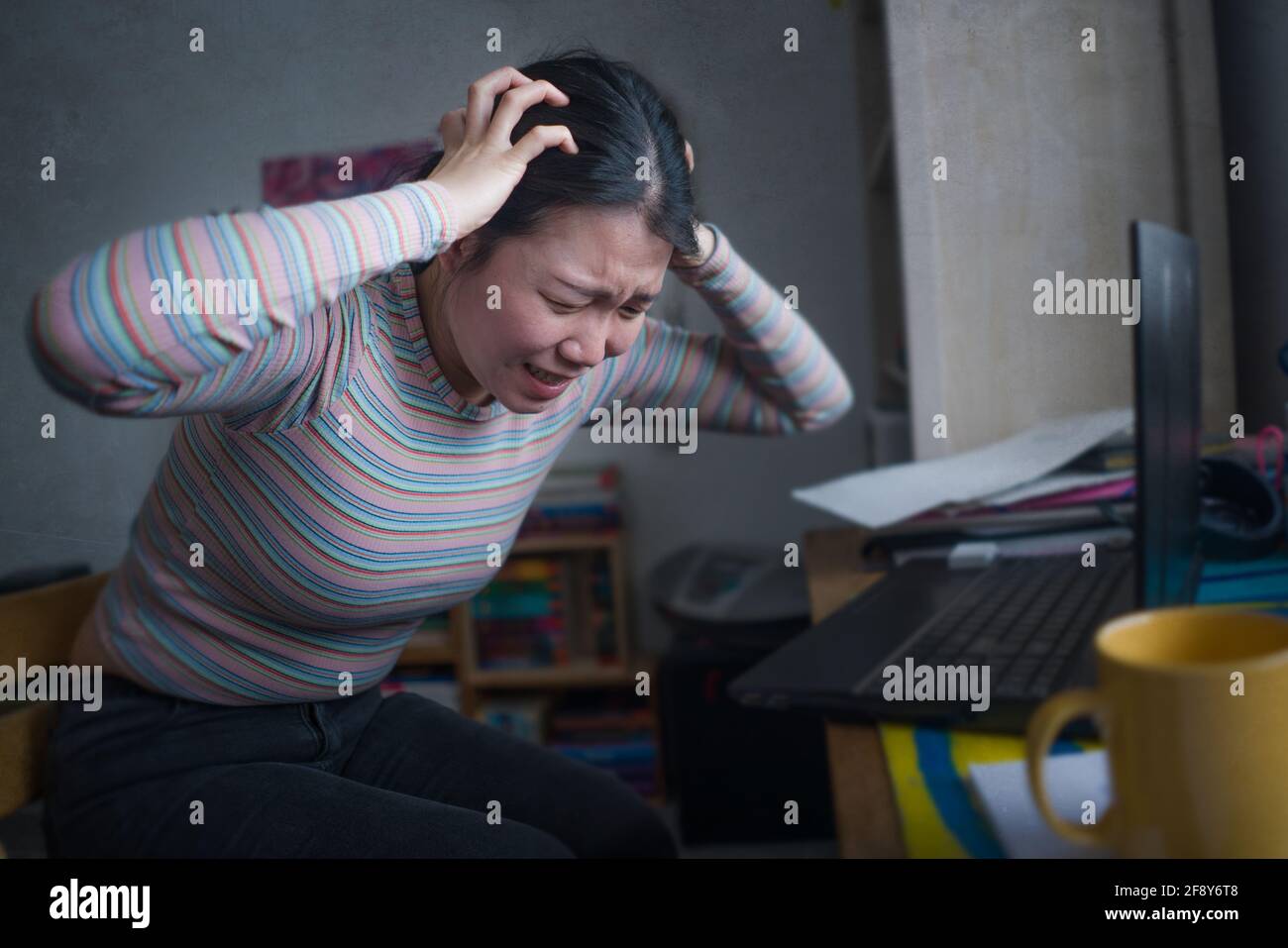 lifestyle portrait of young stressed and worried Asian Chinese woman ...