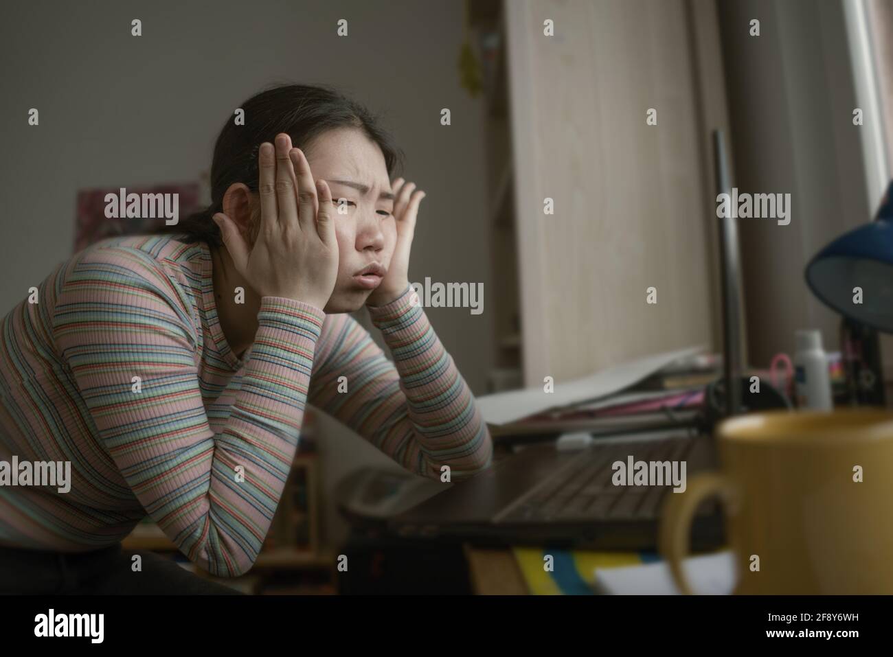 lifestyle portrait of young stressed and worried Asian Japanese woman ...