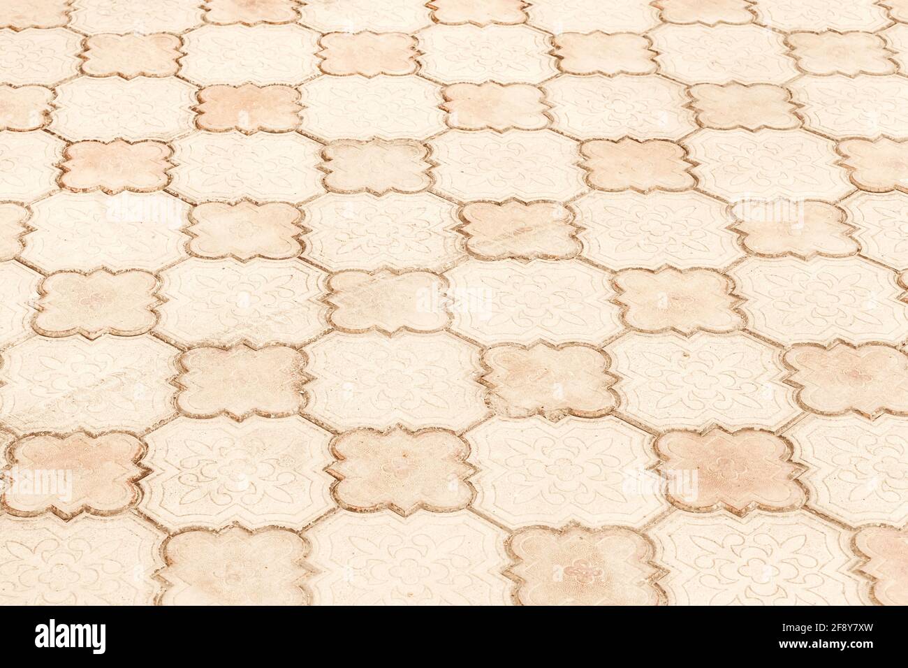 Light warm color paving slabs urban floor with geometric pattern ...