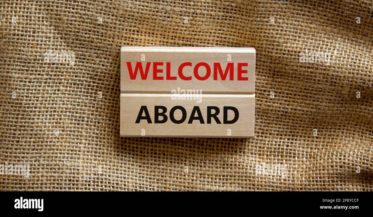 Welcome aboard symbol. Wooden blocks with words 'Welcome aboard ...